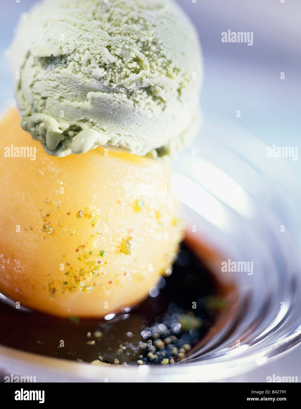Pear and scoop of pistichio ice cream Stock Photo - Alamy
