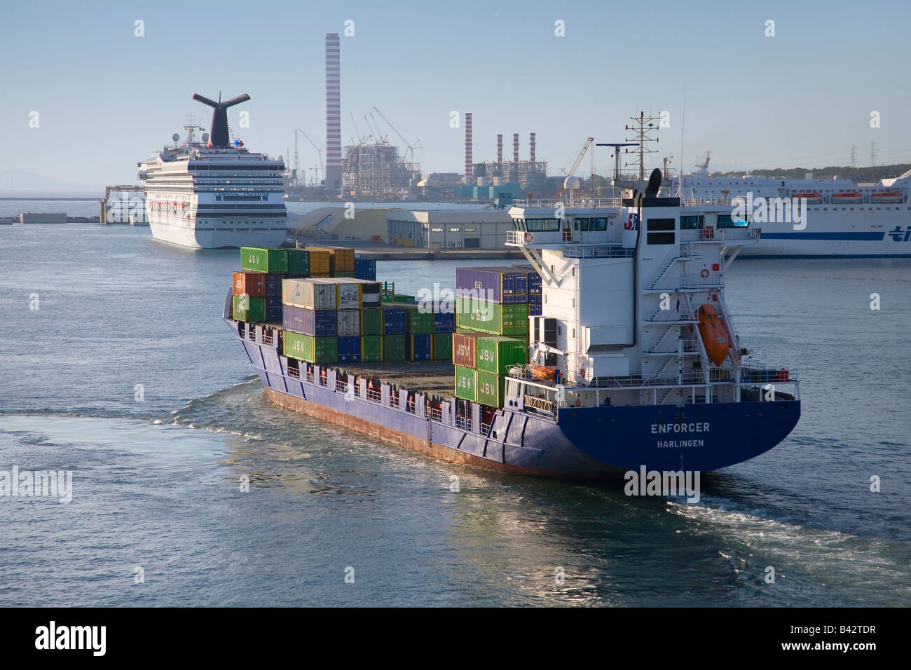 Cargo ship carrying containers departing Port of Civitavecchia, Italy ...