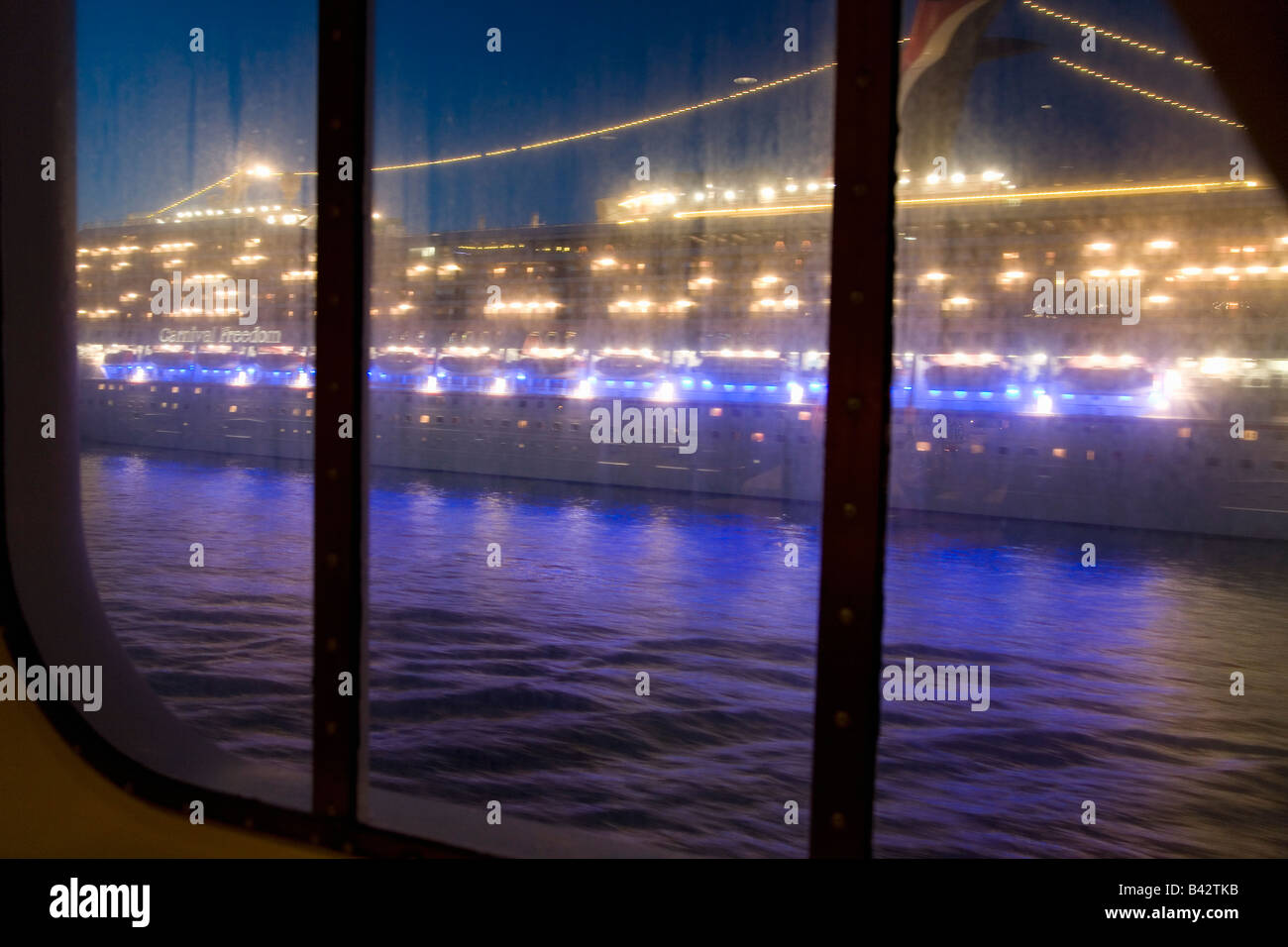 Cruise ship with lights on departing Port of Civitavecchia, Italy, the ...