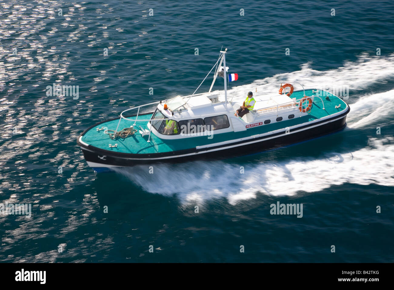 Pilot ship escorting Oceania Cruise ship out of port Stock Photo - Alamy