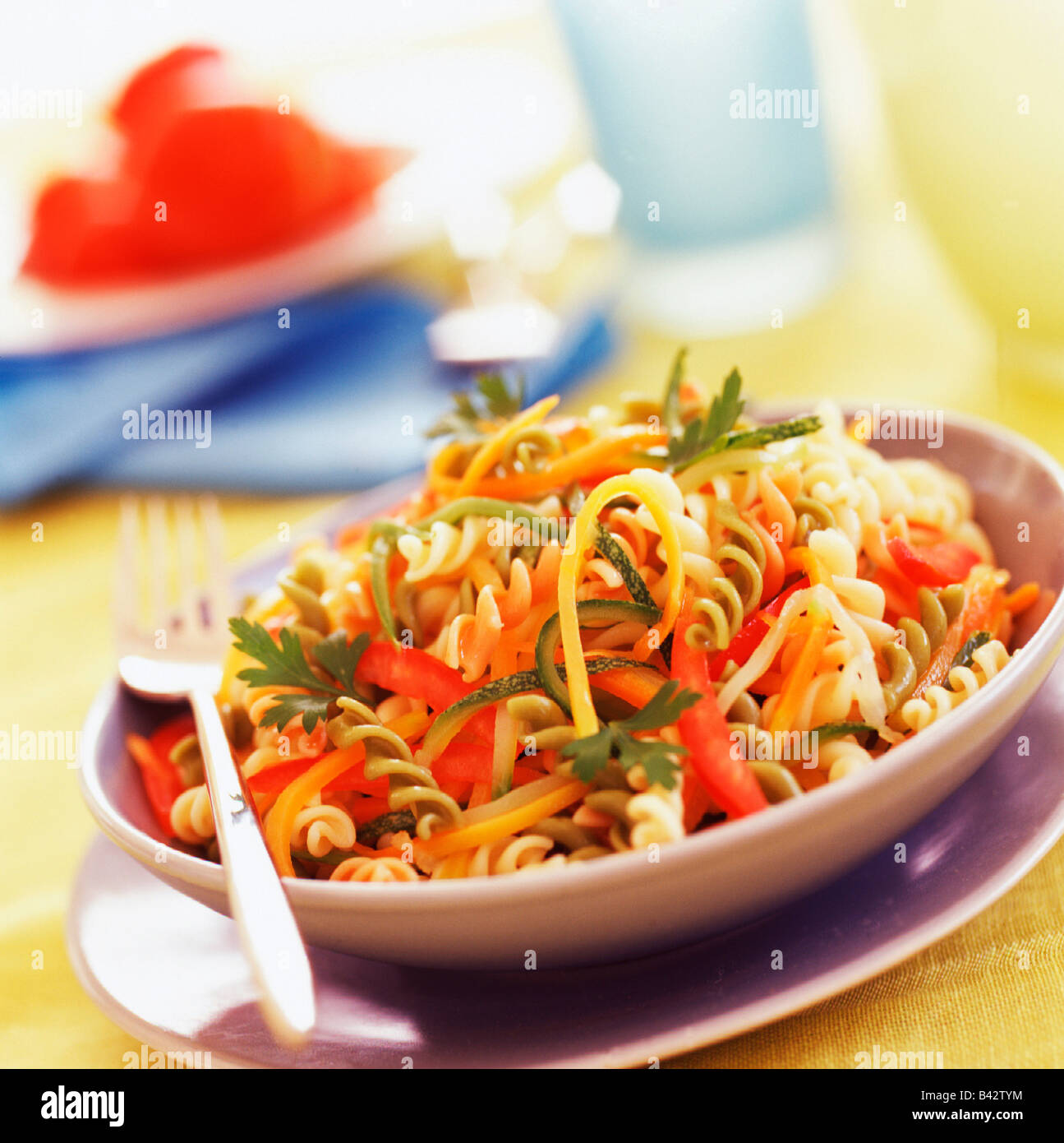 three-colored fusilli with vegetables Stock Photo - Alamy