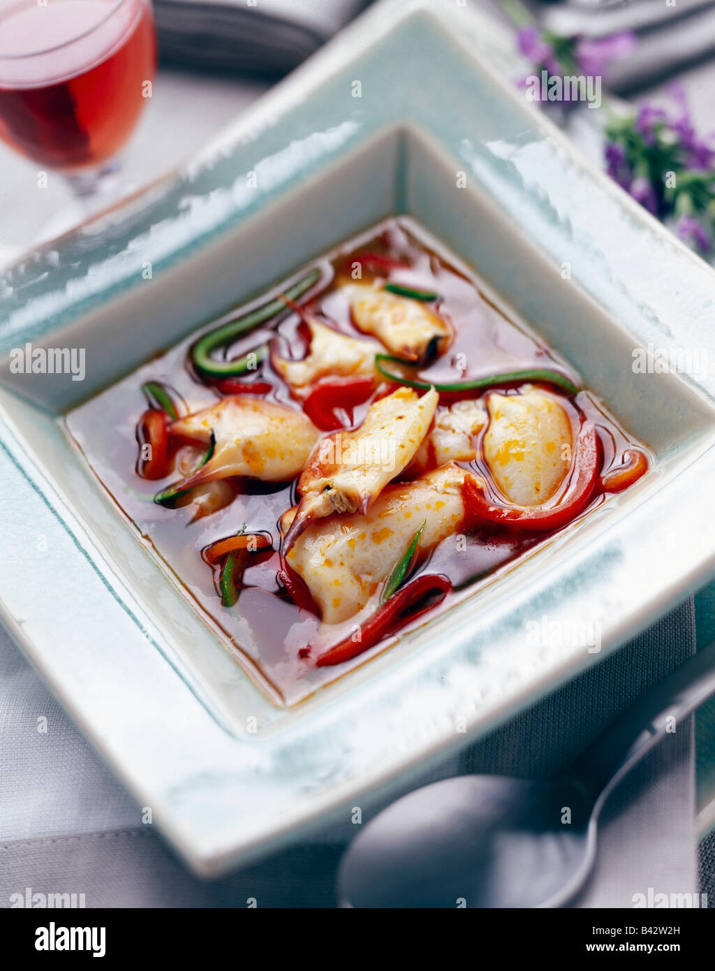 Crab pincers nage with harissa Stock Photo - Alamy