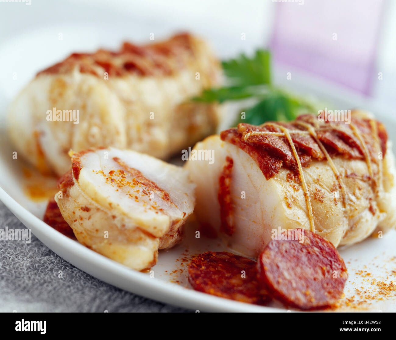 small monkfish roasts with Chorizo Stock Photo - Alamy