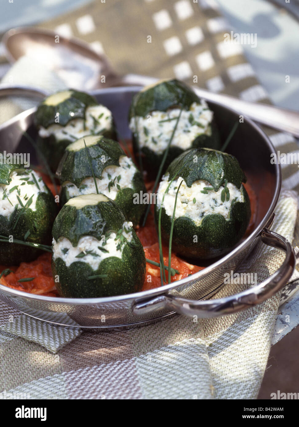 round baby courgettes stuffed with cheese Stock Photo - Alamy