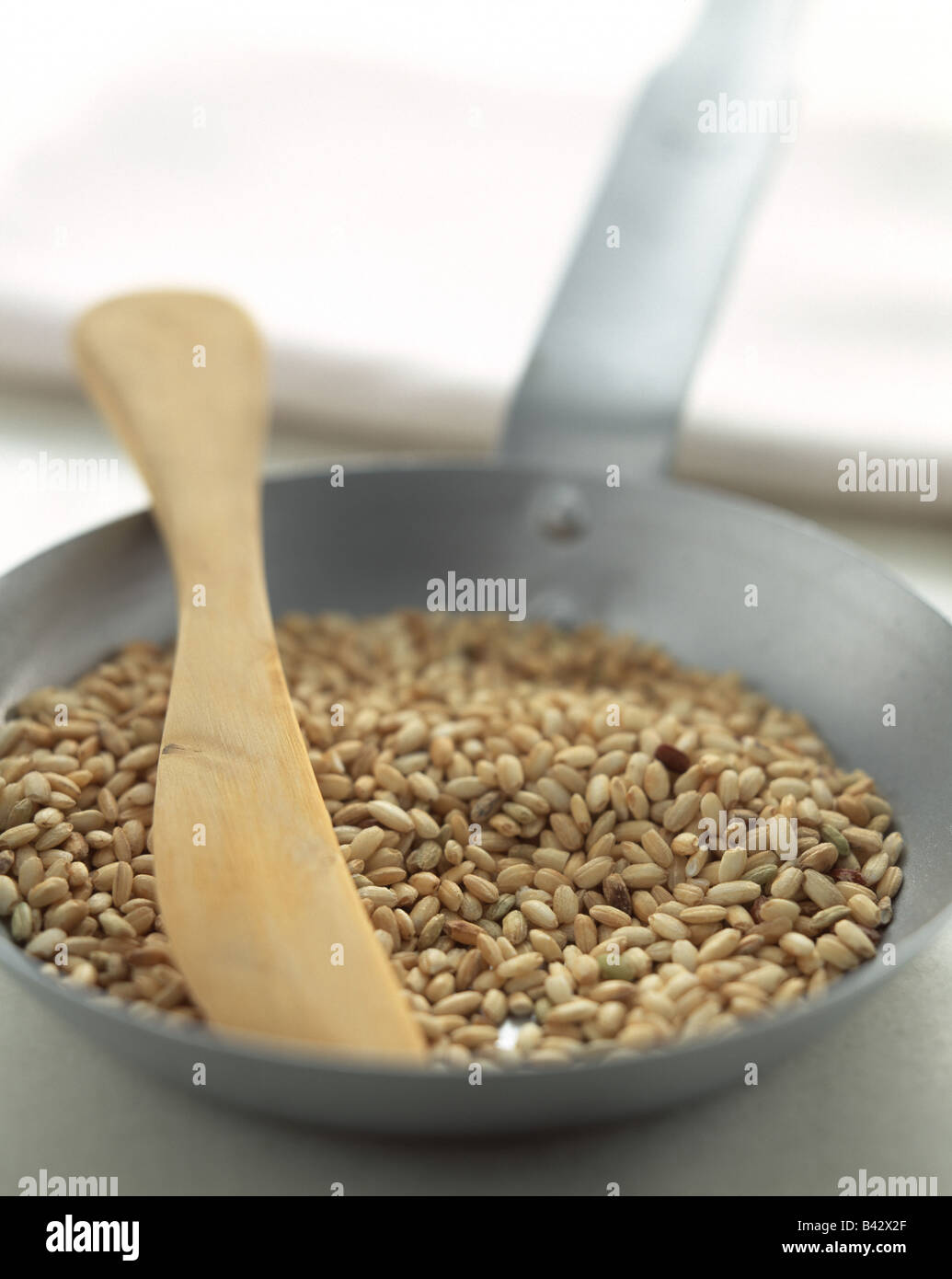 Wheat in frying pan Stock Photo - Alamy