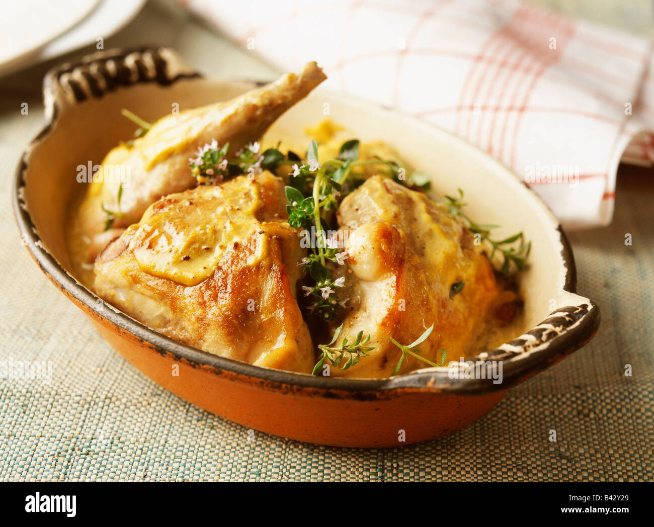 Rabbit with mustard sauce Stock Photo - Alamy