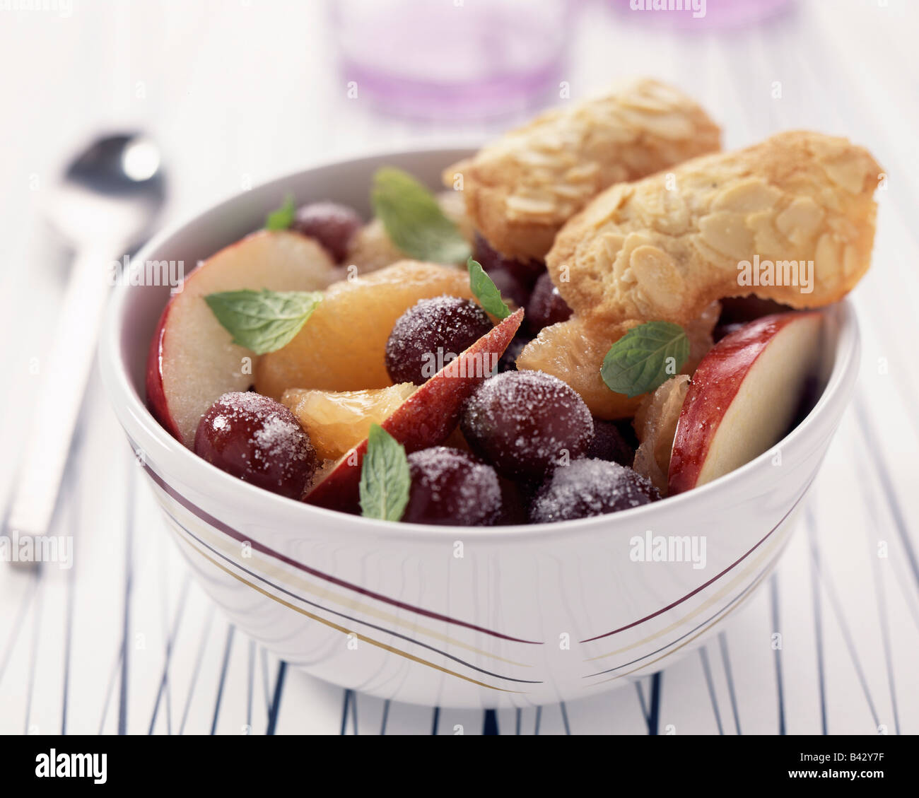 Grapefruit,grape and apple fruit salad with almond tuile biscuits Stock ...
