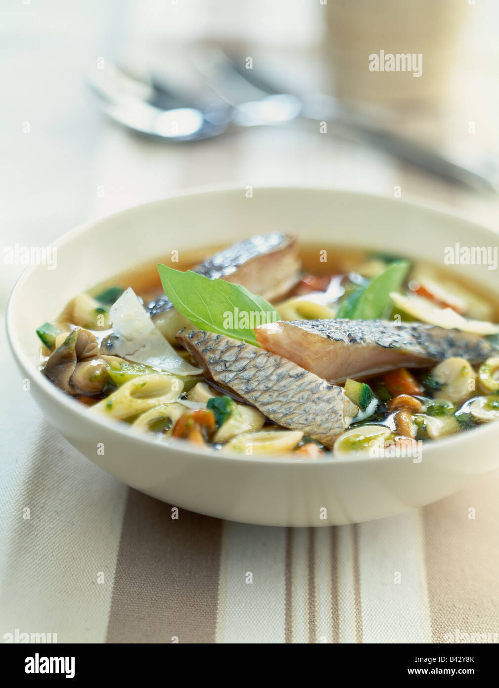 Penne and fish soup Stock Photo - Alamy