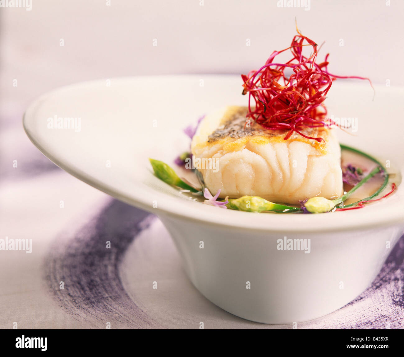 Cod with mauve soup and chinese garlic Stock Photo - Alamy