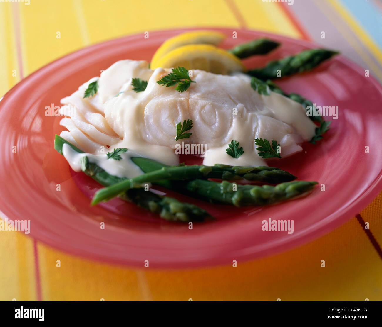 piece of cod with asparagus Stock Photo - Alamy