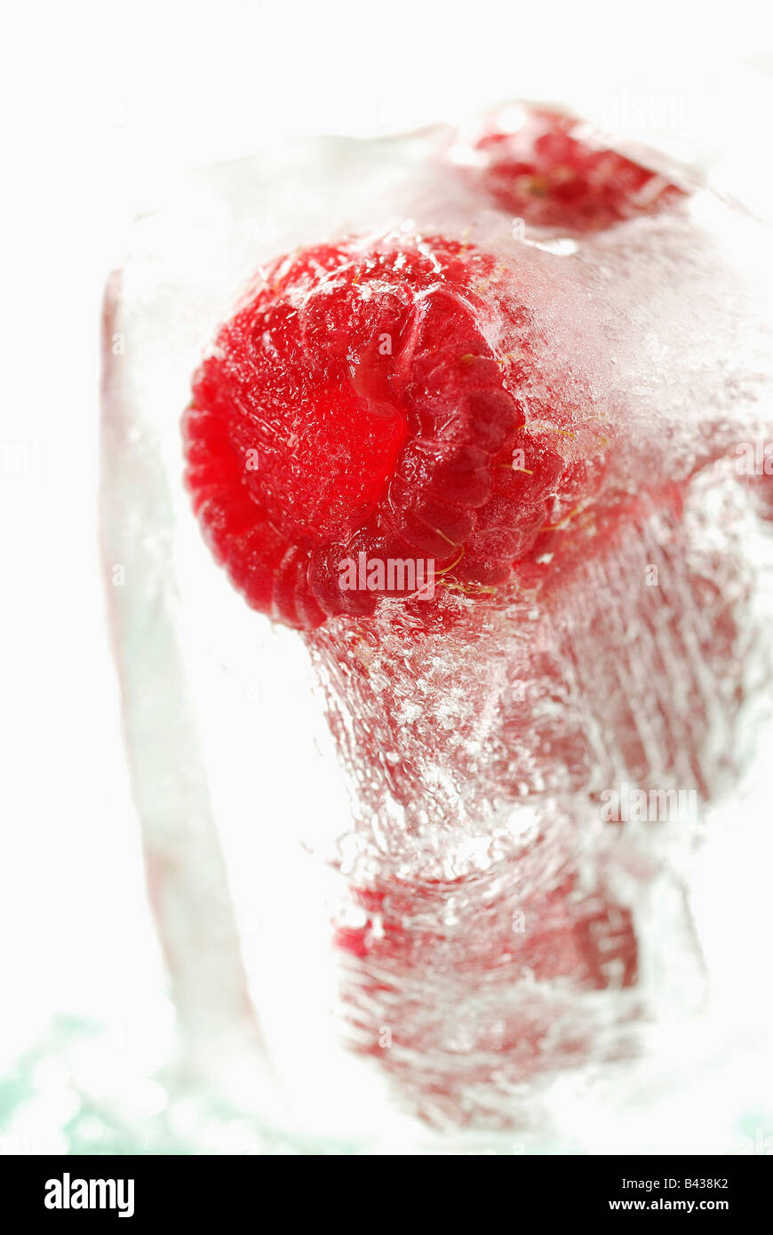 Raspberries in ice Stock Photo - Alamy