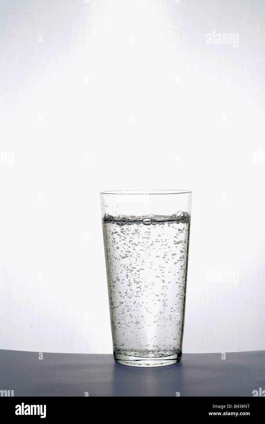 Glass of fizzy water Stock Photo - Alamy