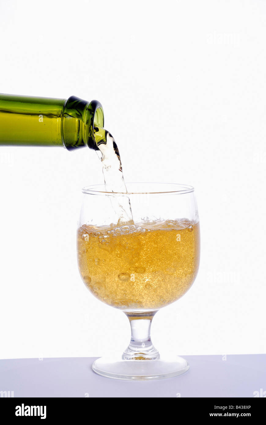 Pouring cider into a glass Stock Photo - Alamy