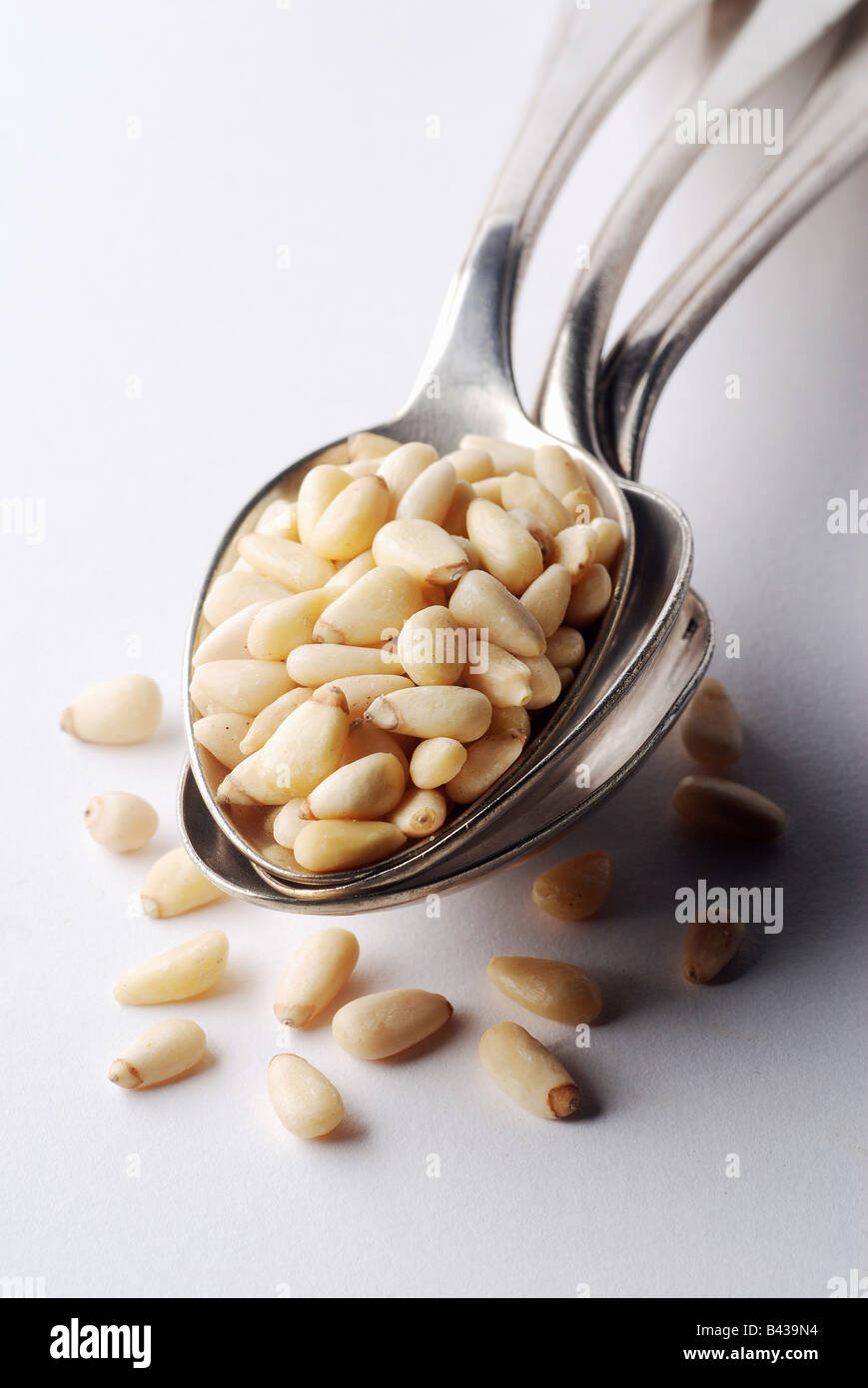 Spoonful of pine nuts Stock Photo - Alamy