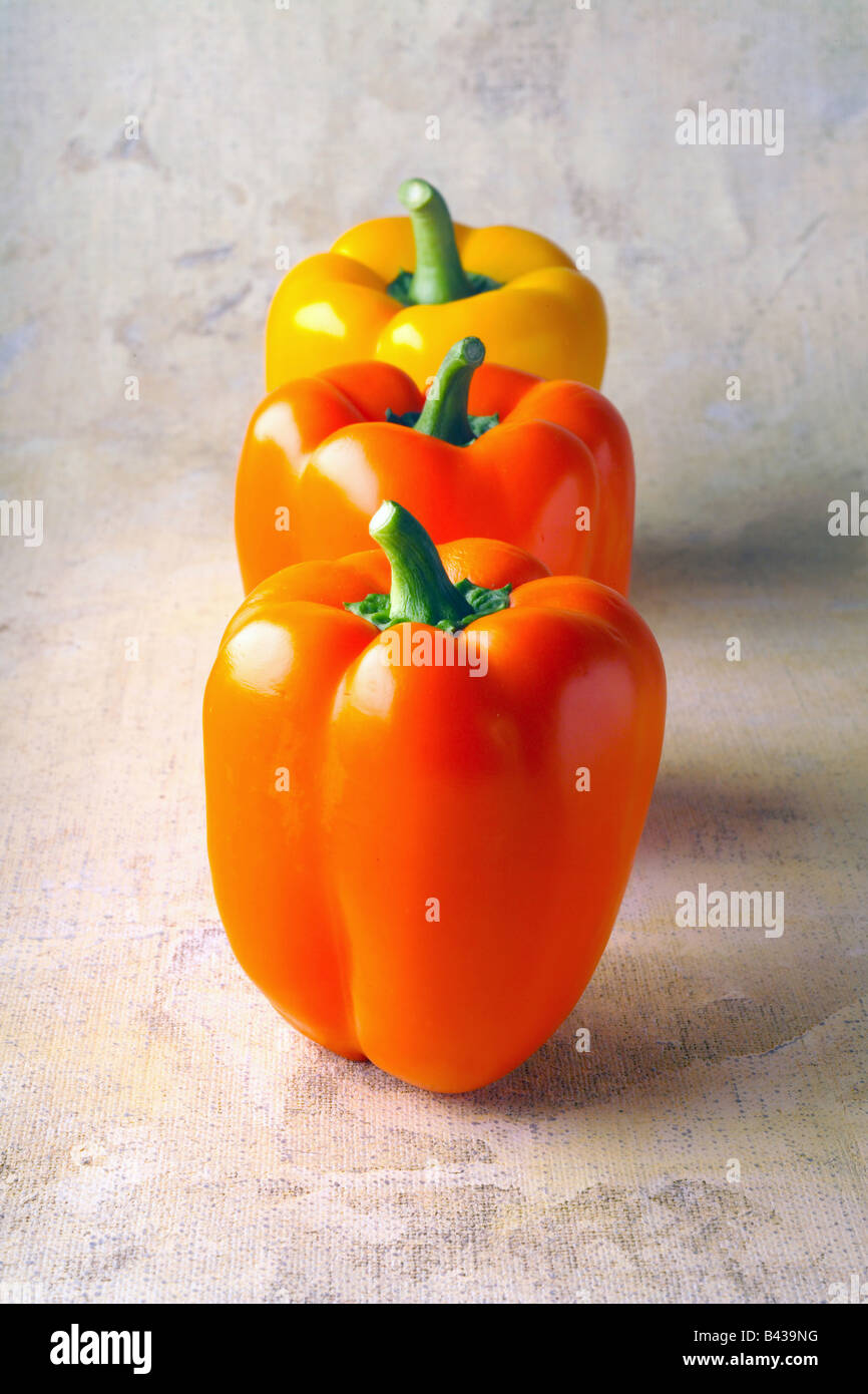 Two orange peppers and one yellow pepper Stock Photo - Alamy