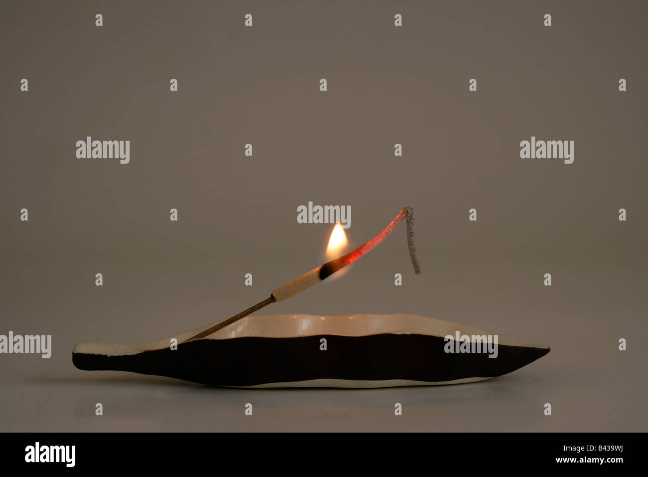 A lit incense stick Stock Photo - Alamy