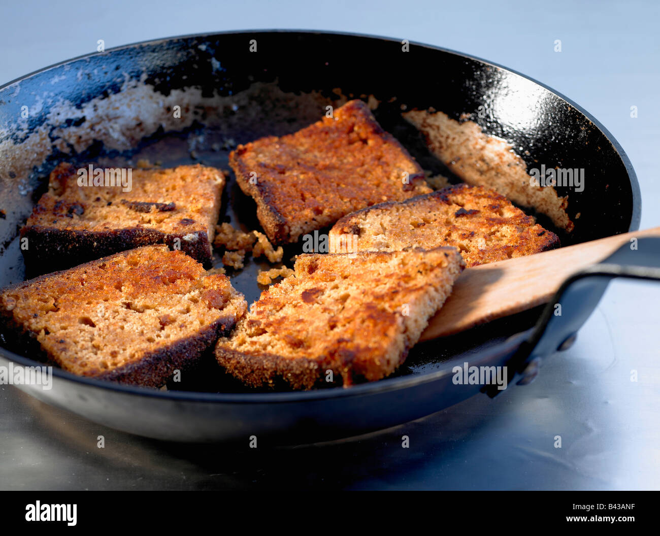 Pan-frying the slices of gingerbread Stock Photo - Alamy