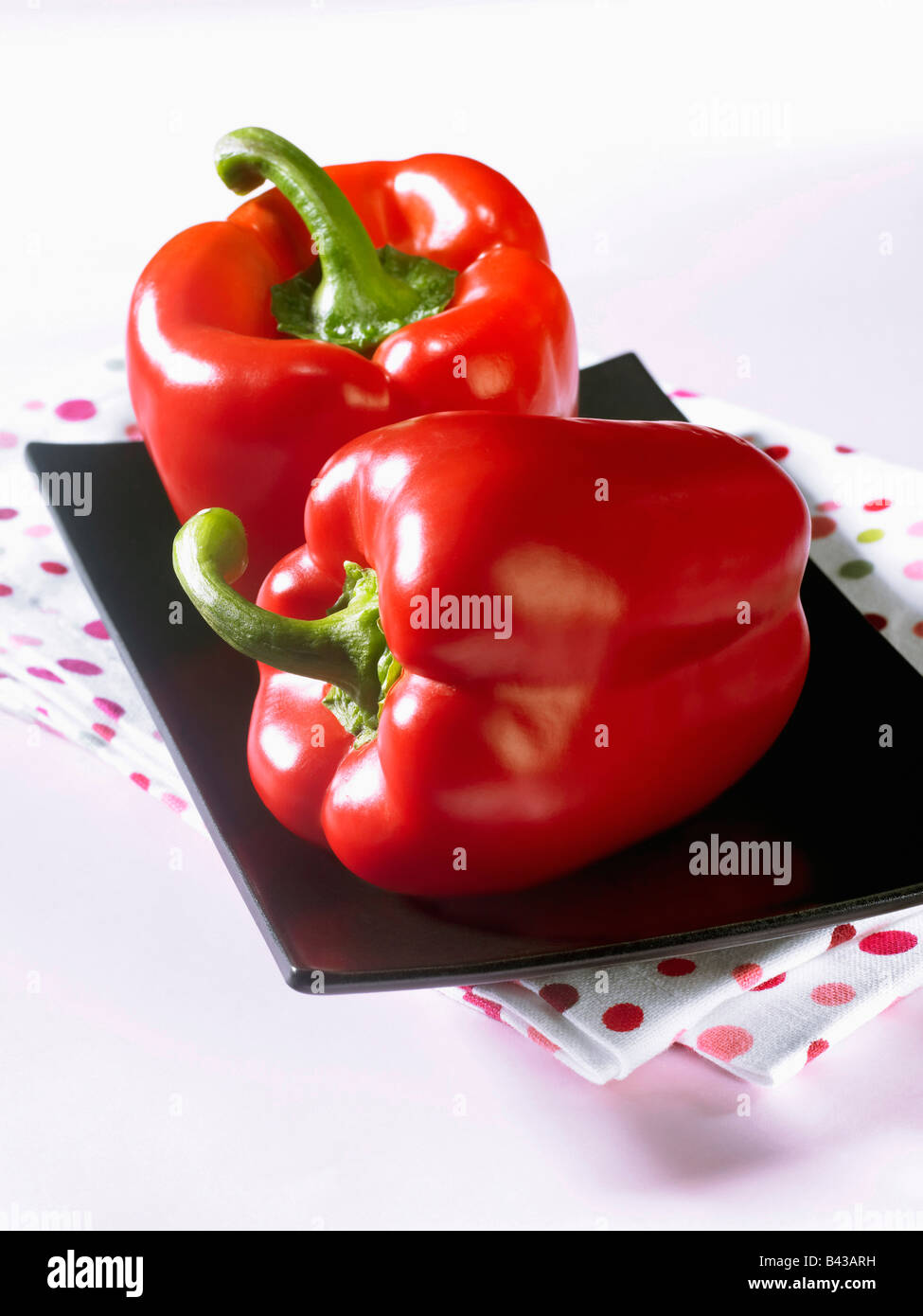 Two red peppers Stock Photo - Alamy
