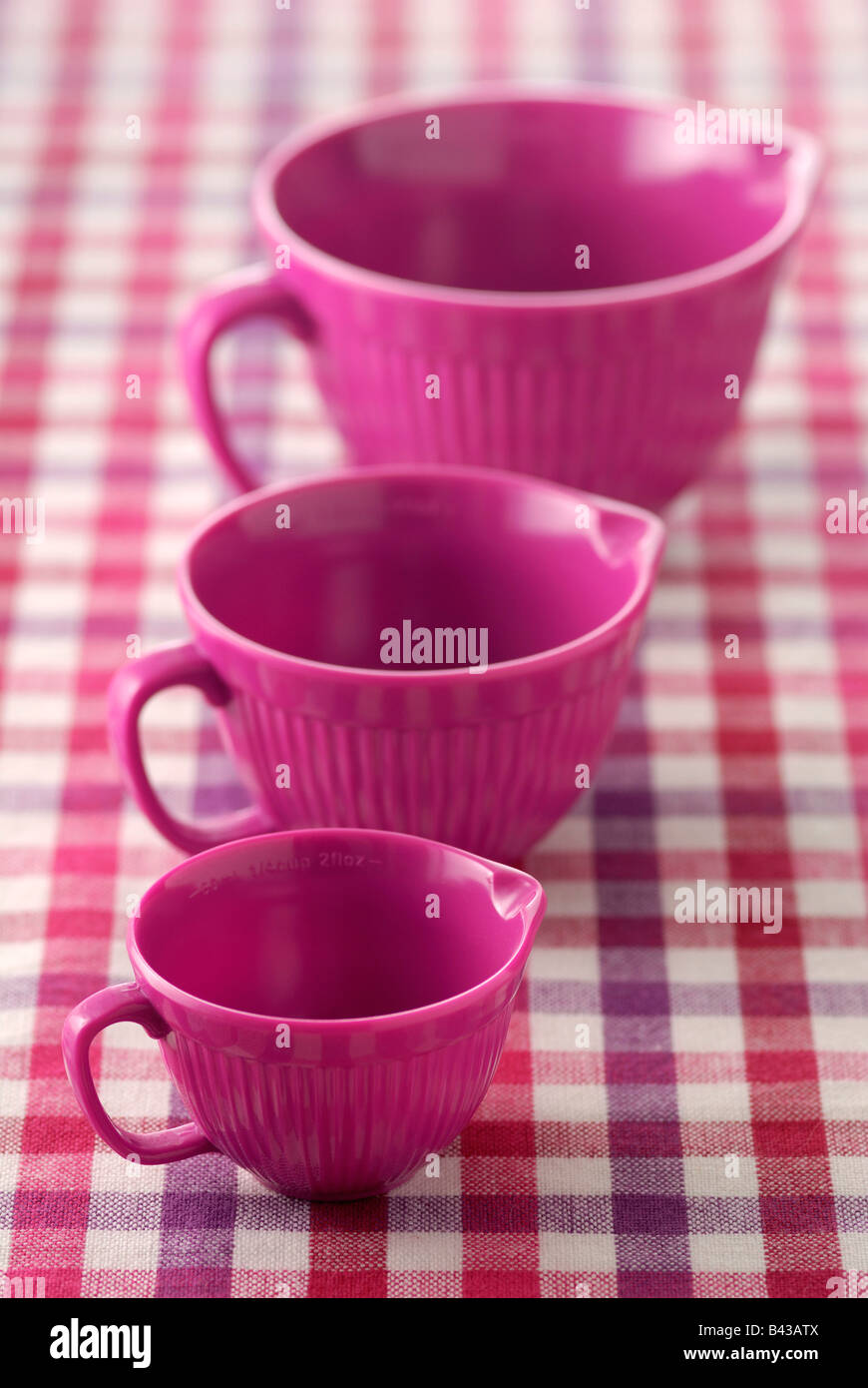 Pink measuring cups Stock Photo - Alamy