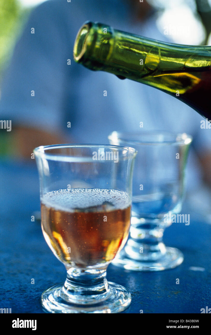 serving a glass of white wine Stock Photo - Alamy