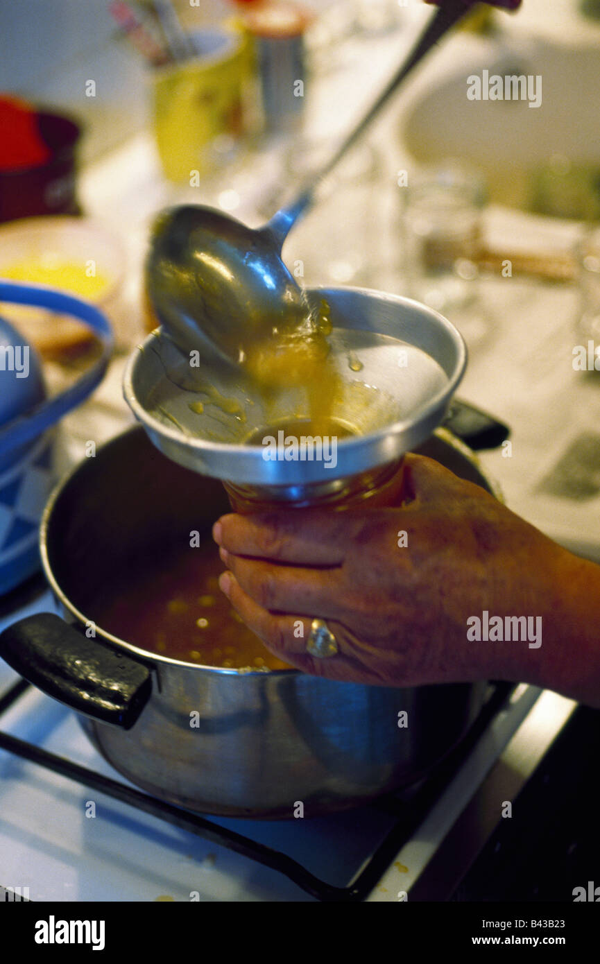 filling jar with jam Stock Photo - Alamy