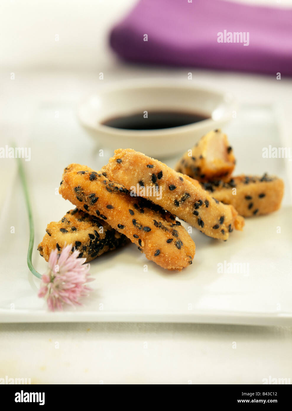 Fingers of red tuna fish breaded with sesame seeds Stock Photo - Alamy