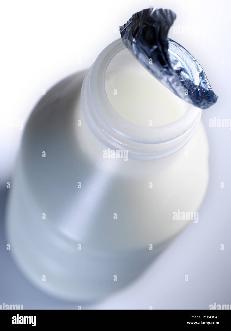 Open bottle of milk Stock Photo - Alamy
