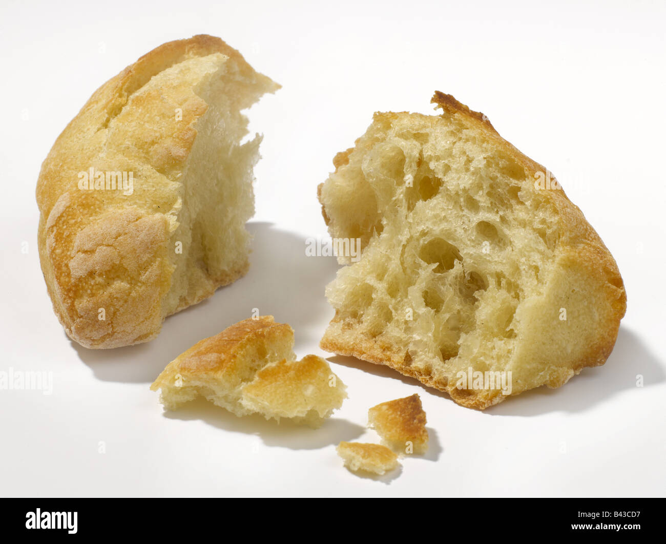Small bread broken open Stock Photo - Alamy