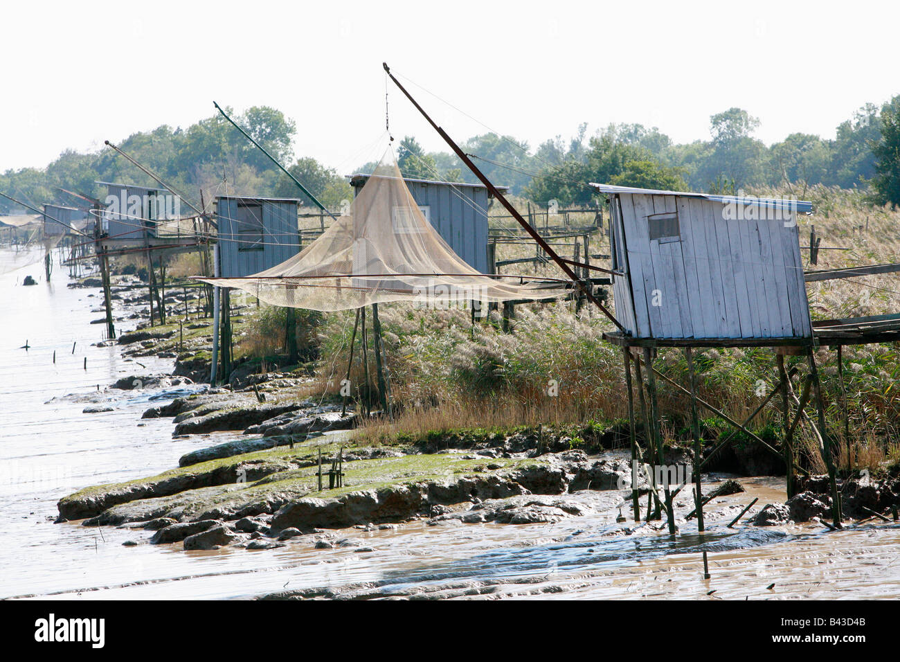 Fishing huts by the river Stock Photo - Alamy