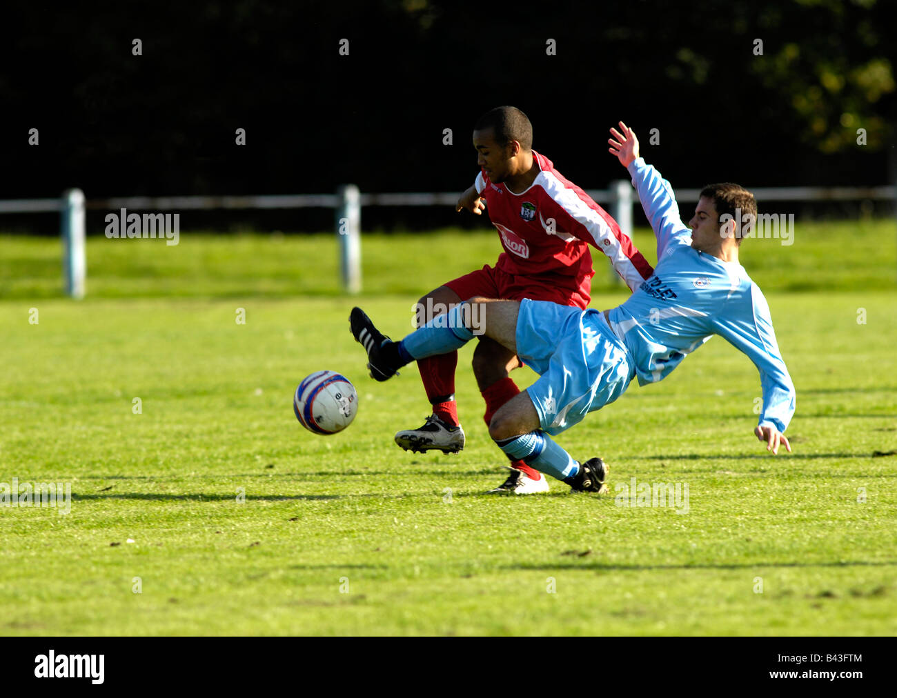 two footballers attempting to win the ball Stock Photo - Alamy