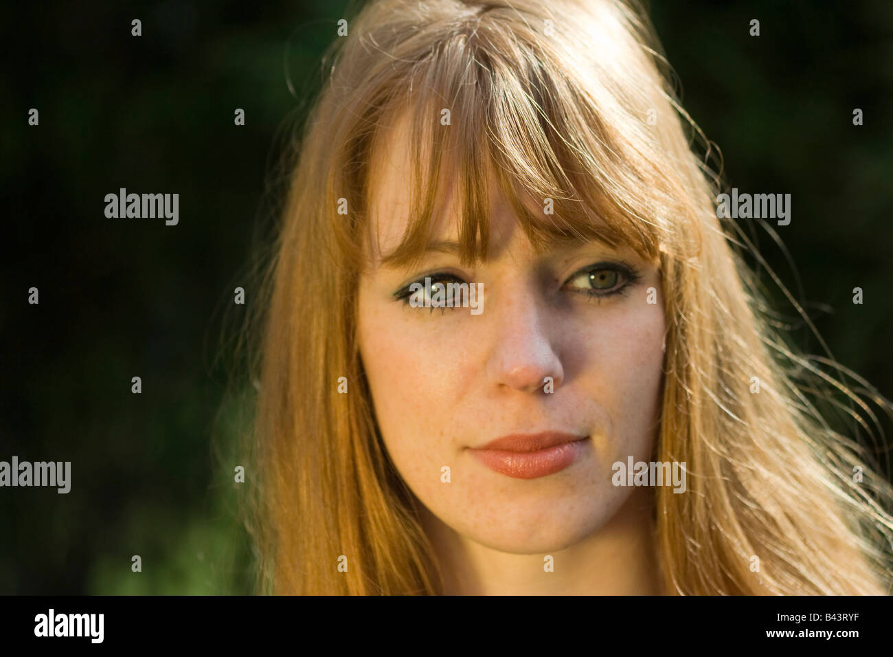Red haired woman smiling Stock Photo - Alamy