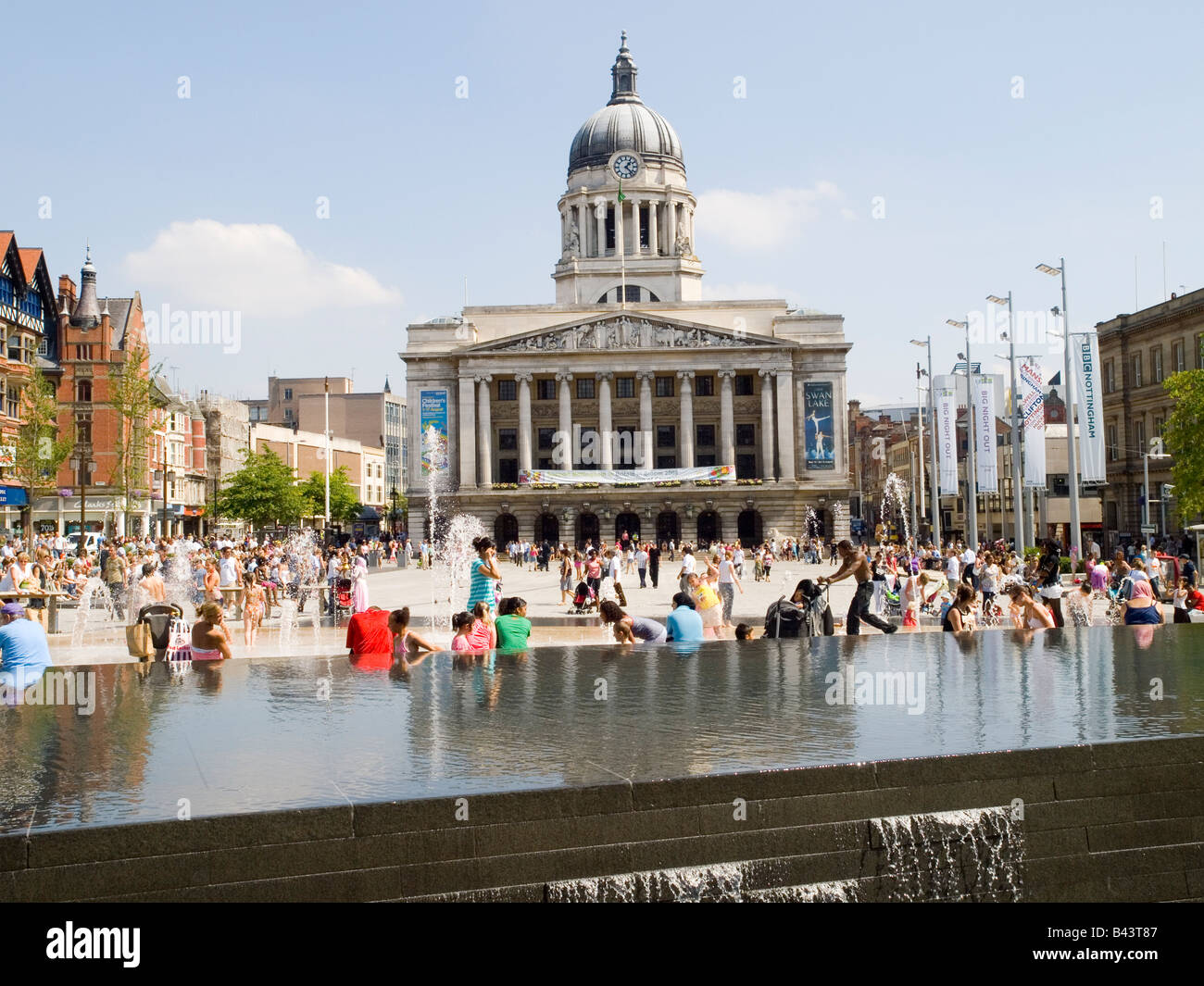 People enjoying a sunny summer afternoon in the Market Square ...