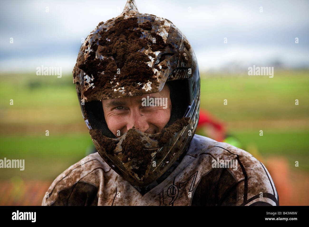 Man with crash helmet involved in motocross racing, racing circuit ...