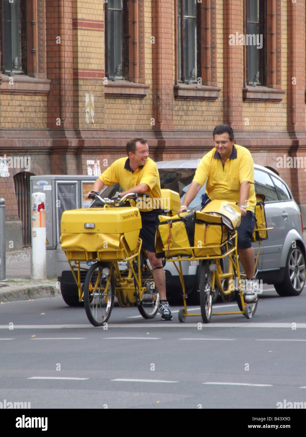 Two postmen on bikes hi-res stock photography and images - Alamy