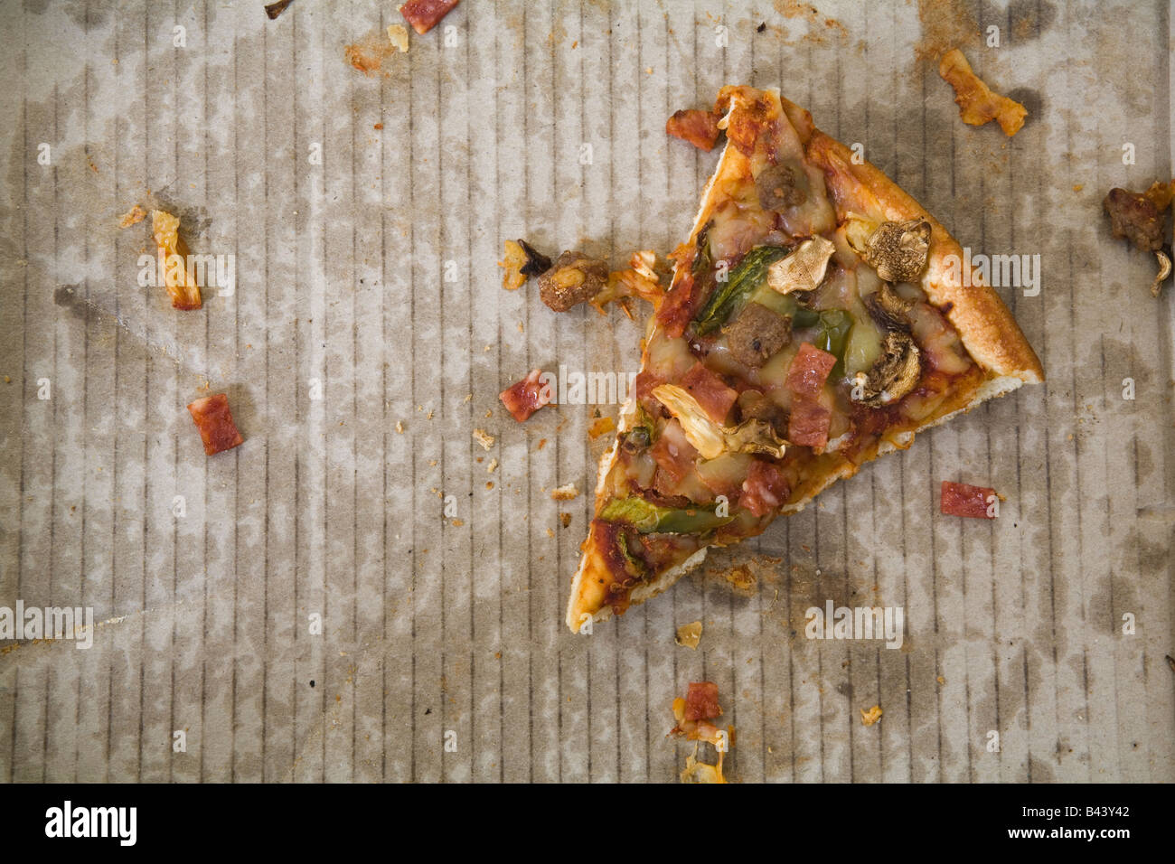 A slice of cold stale pizza in a pizza box Stock Photo - Alamy