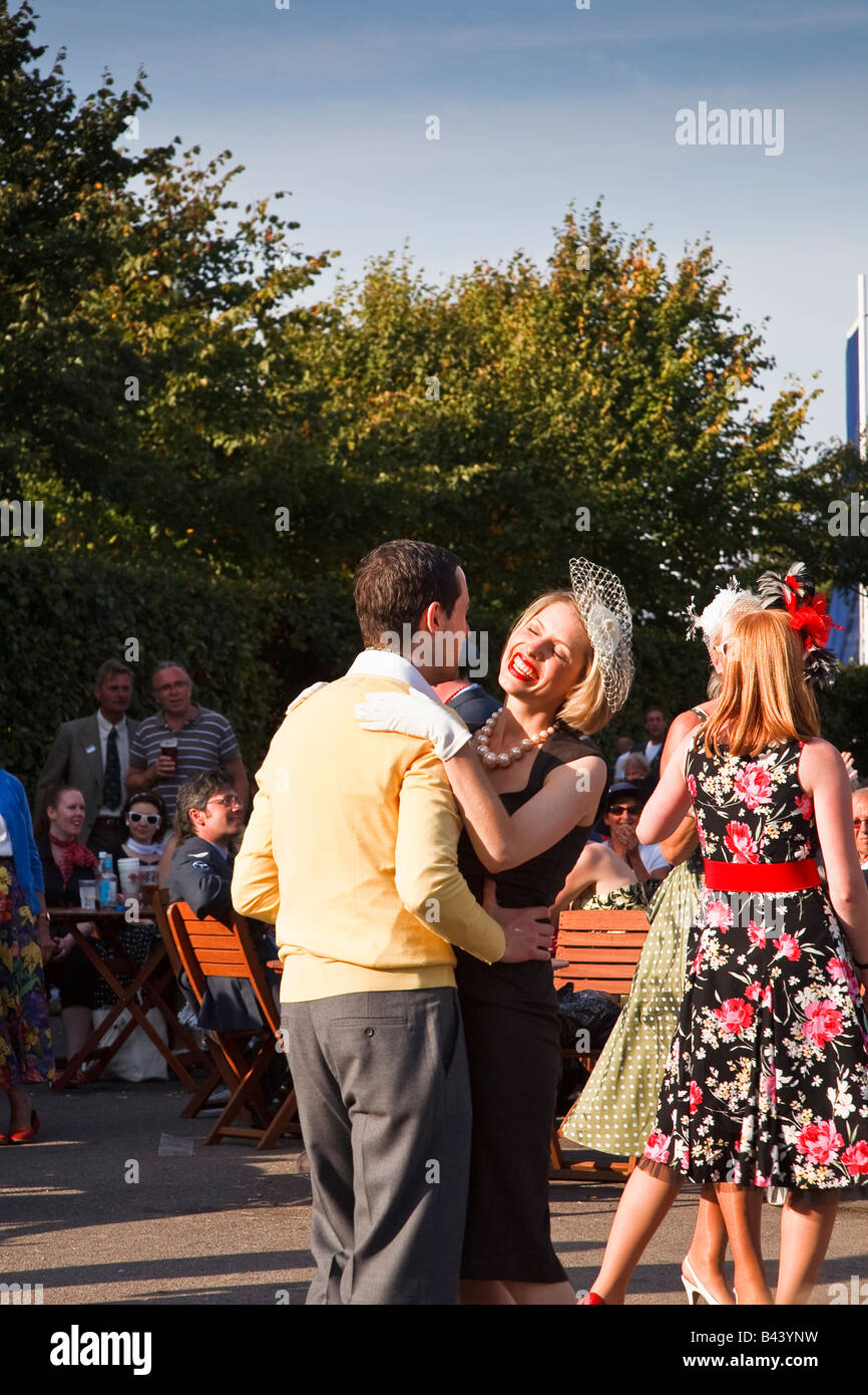 A couple in period dress dancing at the Goodwood Revival in West Sussex ...