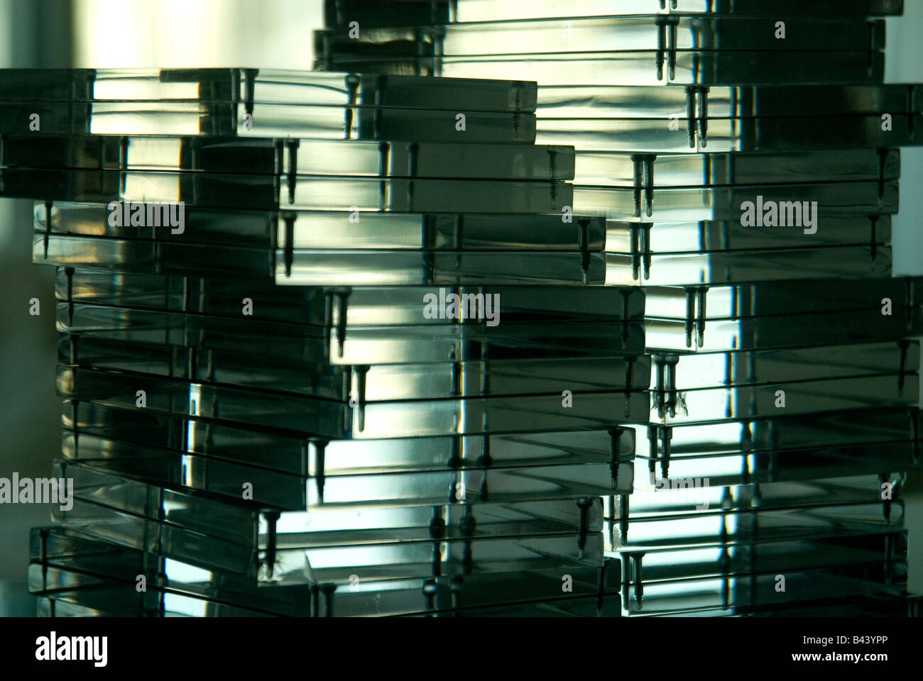 Stacks of plastic rectangles with light shining through them forms an ...