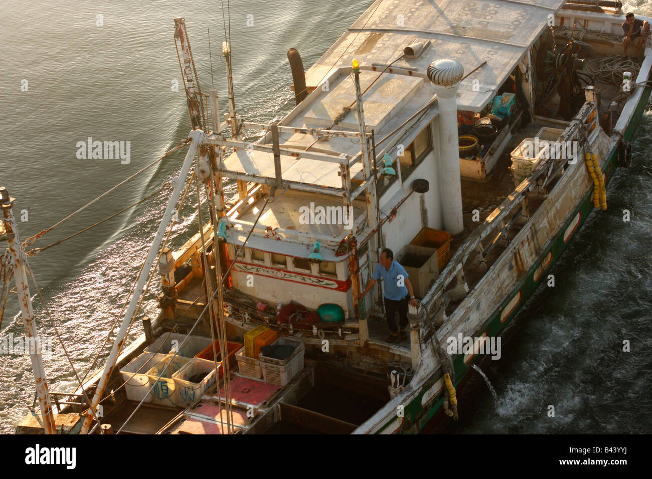 A fishing boat leaves AnPing Harbor. Tainan, Taiwan Stock Photo - Alamy