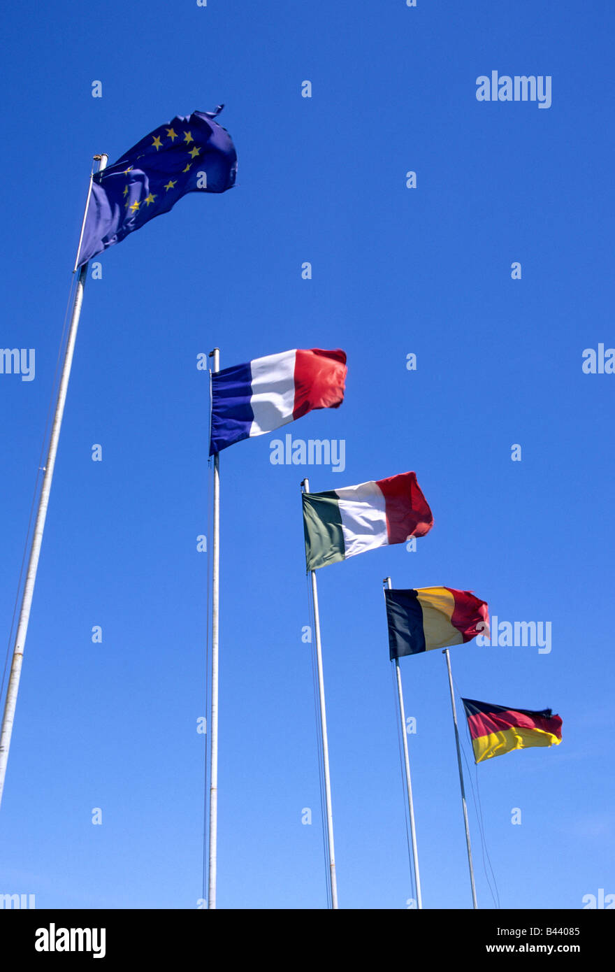Flags of Europe waving under a clear blue sky highlighting international unity and diversity ...