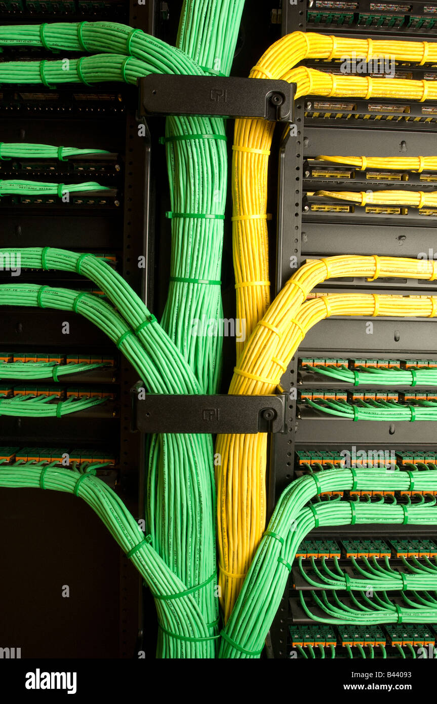 Bundles of yellow and green computer wires at data center computer ...