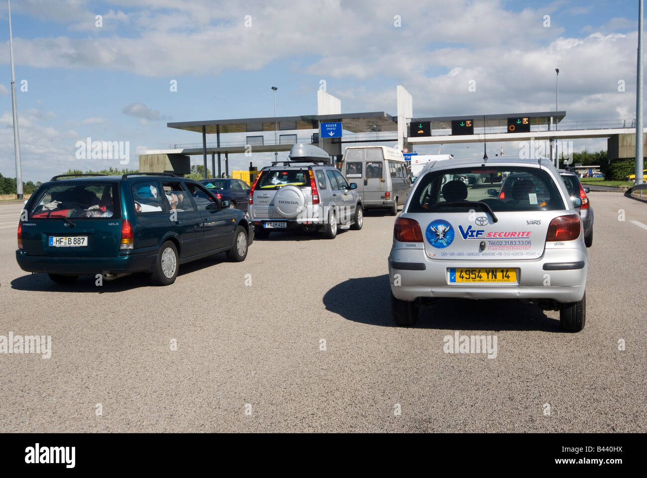Cars queuing in traffic at a toll booth on the A13 in Normandy A13 ...