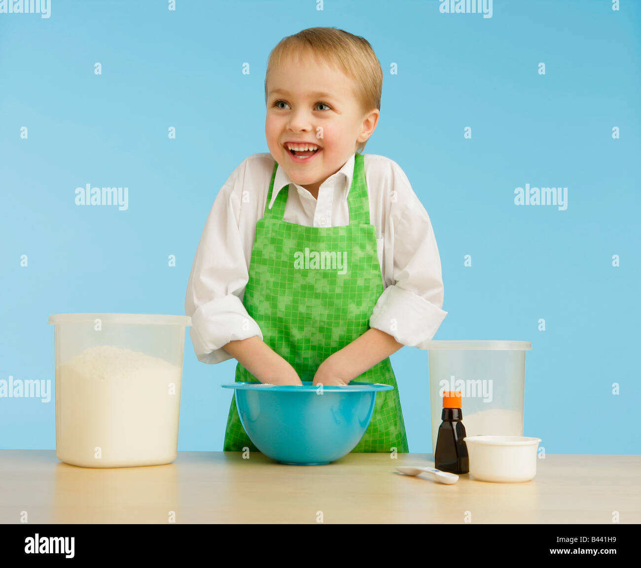 Child mixing ingredients Stock Photo - Alamy