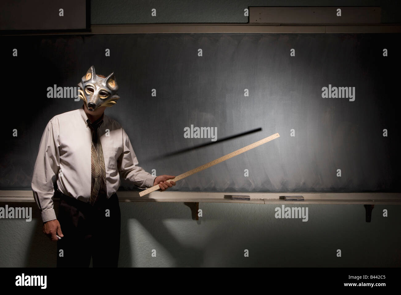 Teacher wearing a mask Stock Photo - Alamy