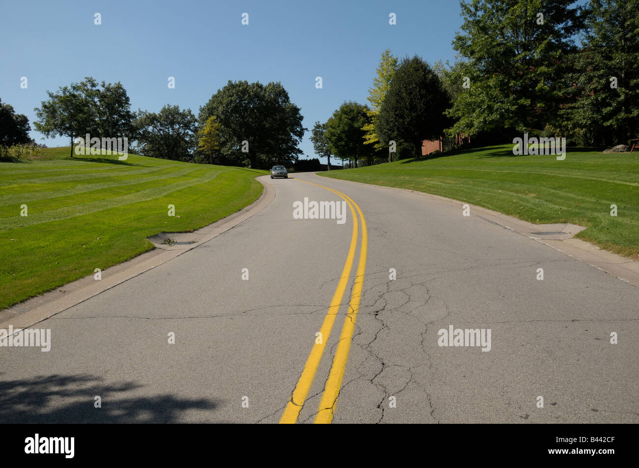 Converging rural road Stock Photo - Alamy
