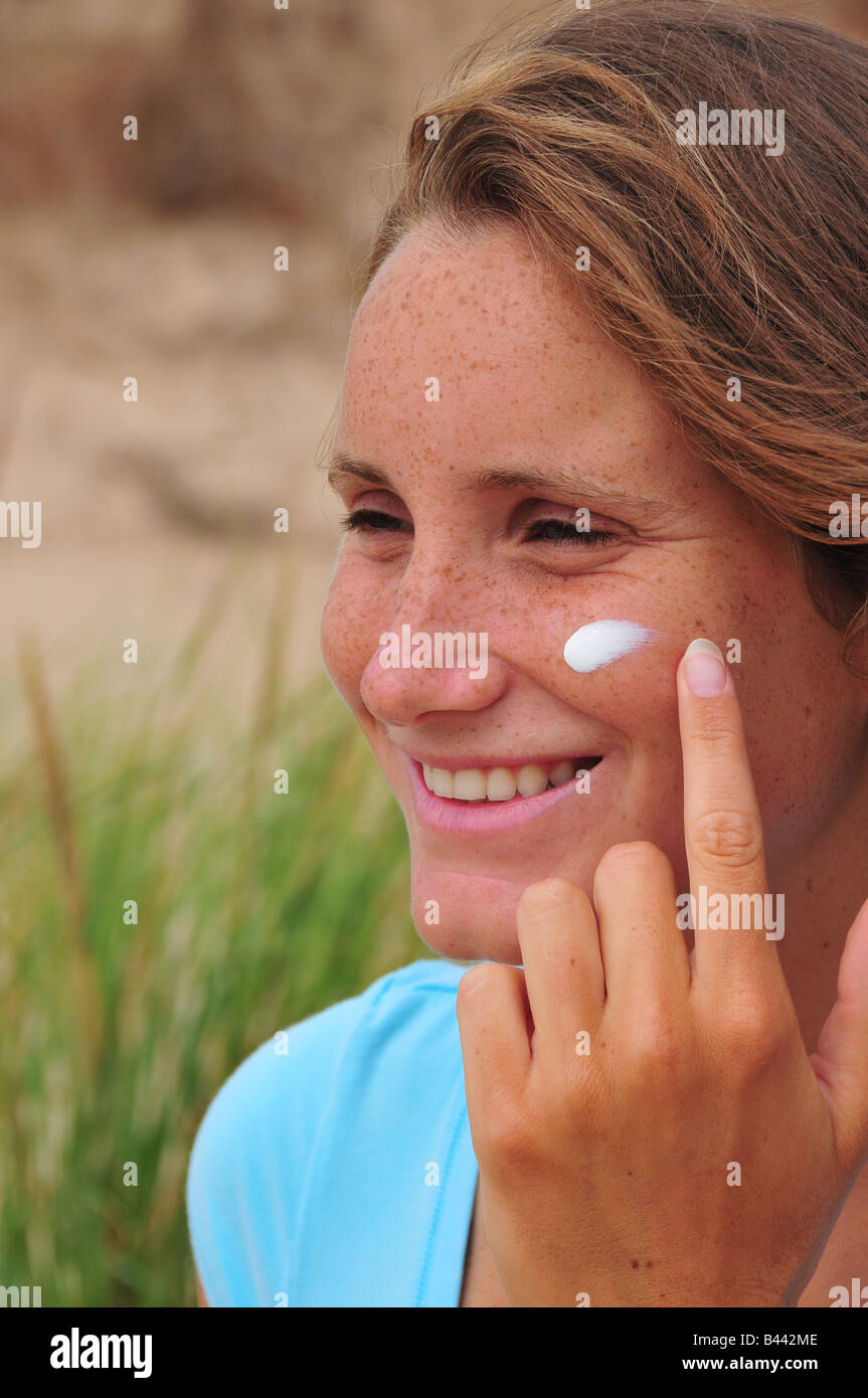 Woman sun cream face hi-res stock photography and images - Alamy