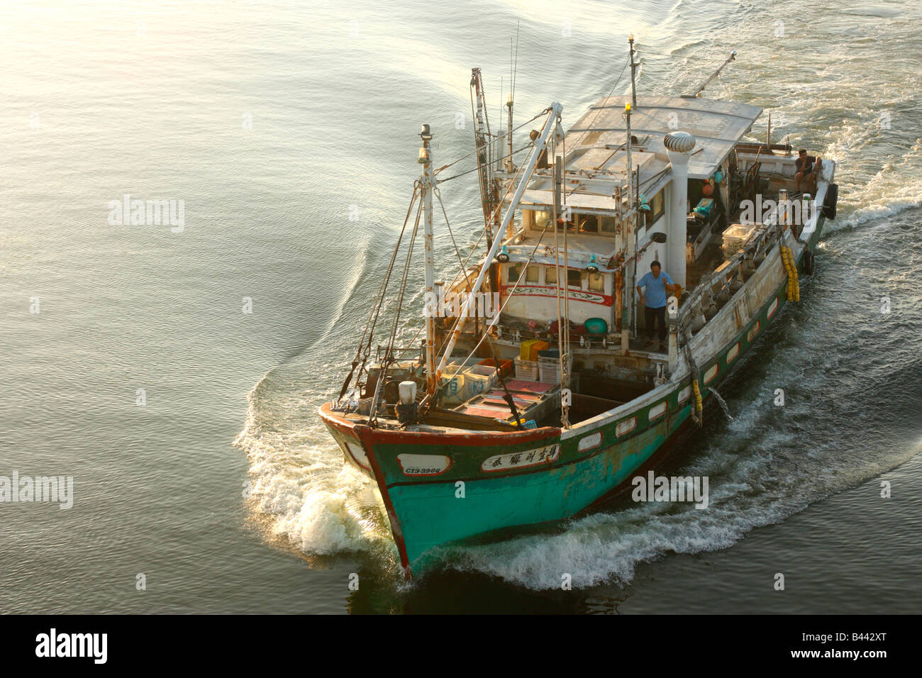 A fishing boat leaves AnPing Harbor. Tainan, Taiwan Stock Photo - Alamy