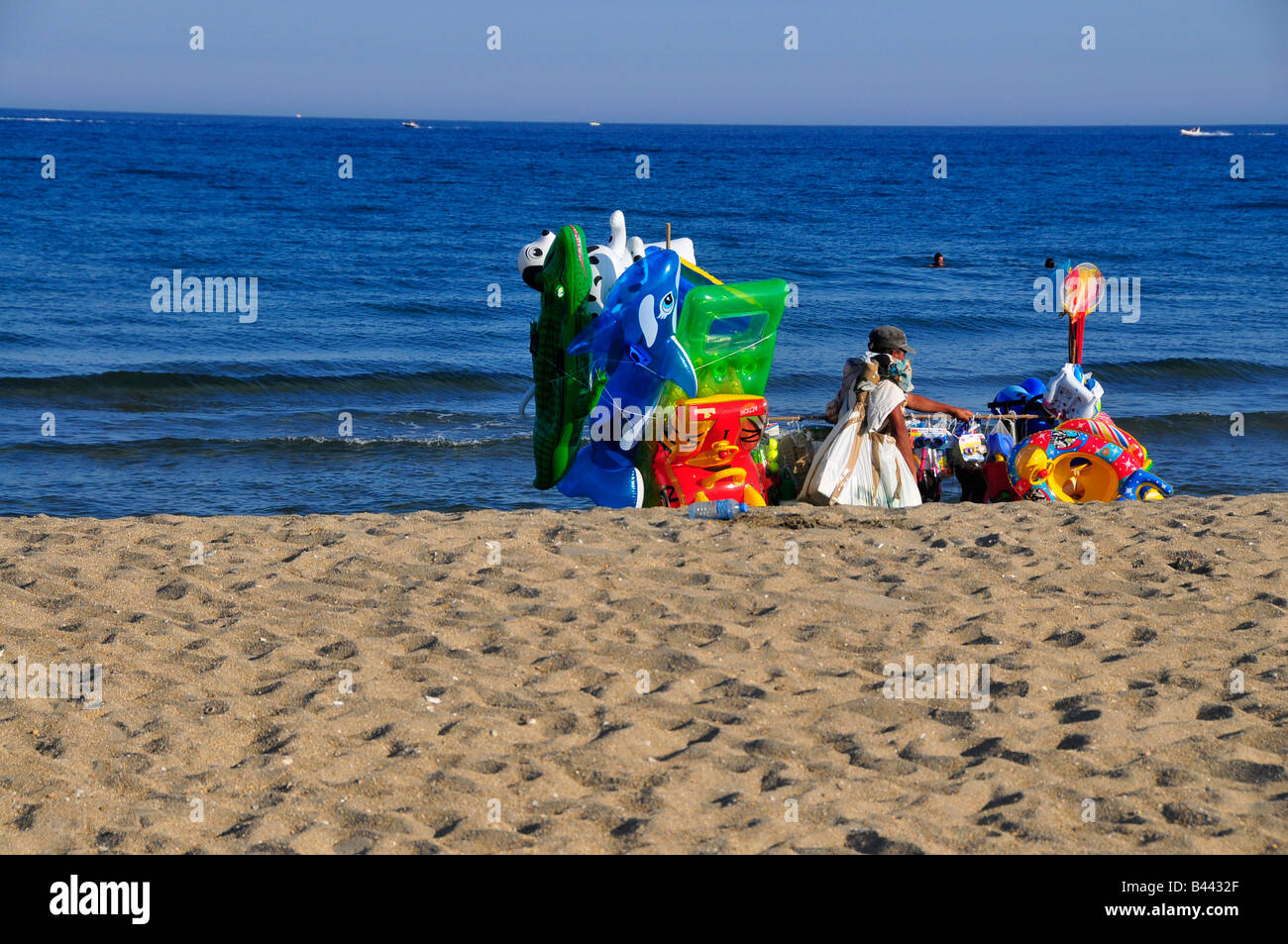 selling rubber rings and rafts on the beach Stock Photo - Alamy