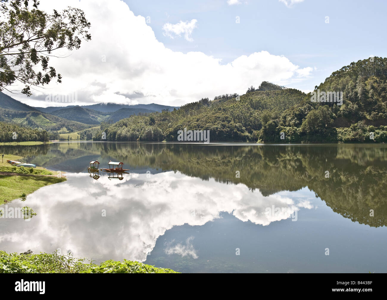 Dramatic scenery of mirror reflections of mountains, forest, sky ...