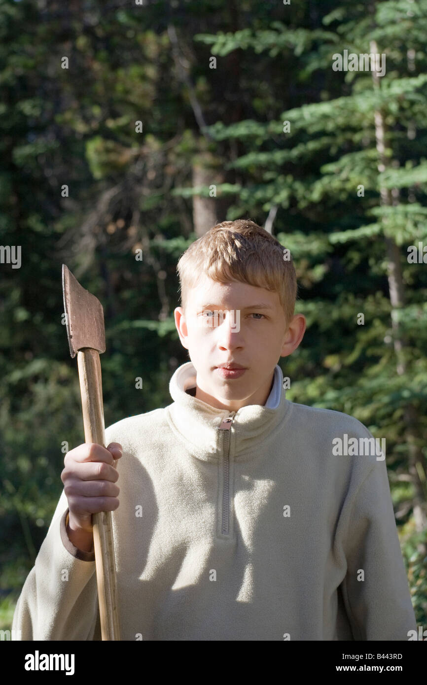 teenage boy holding an axe - wood chopping in jasper national park ...