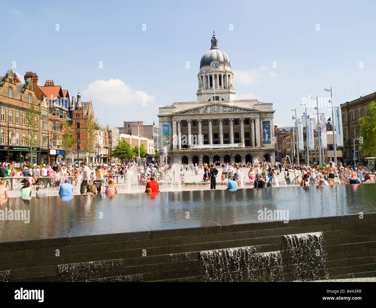 People enjoying a sunny summer afternoon in the Market Square ...